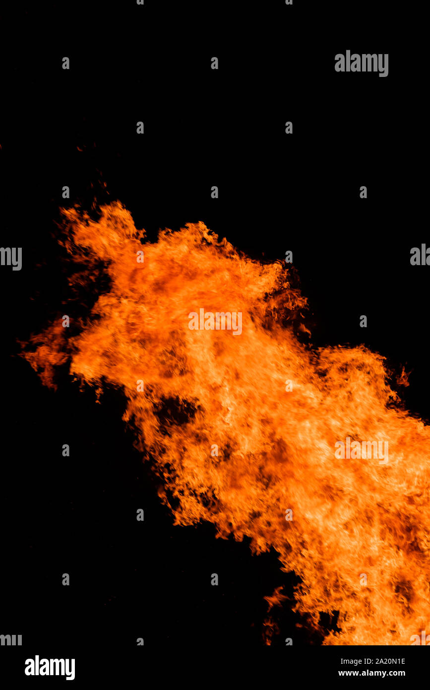 Blaze fire flame In the dark background. Tongues of flame against the ...