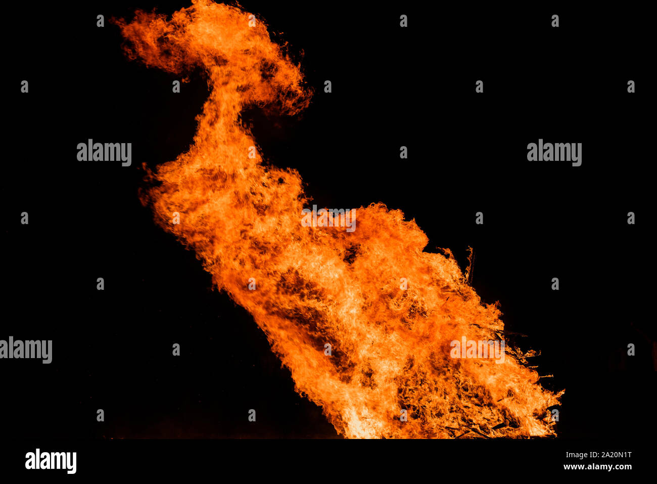 Blaze fire flame In the dark background. Tongues of flame against the ...