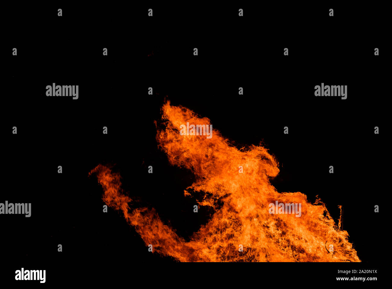 Blaze fire flame In the dark background. Tongues of flame against the night sky Stock Photo - Alamy