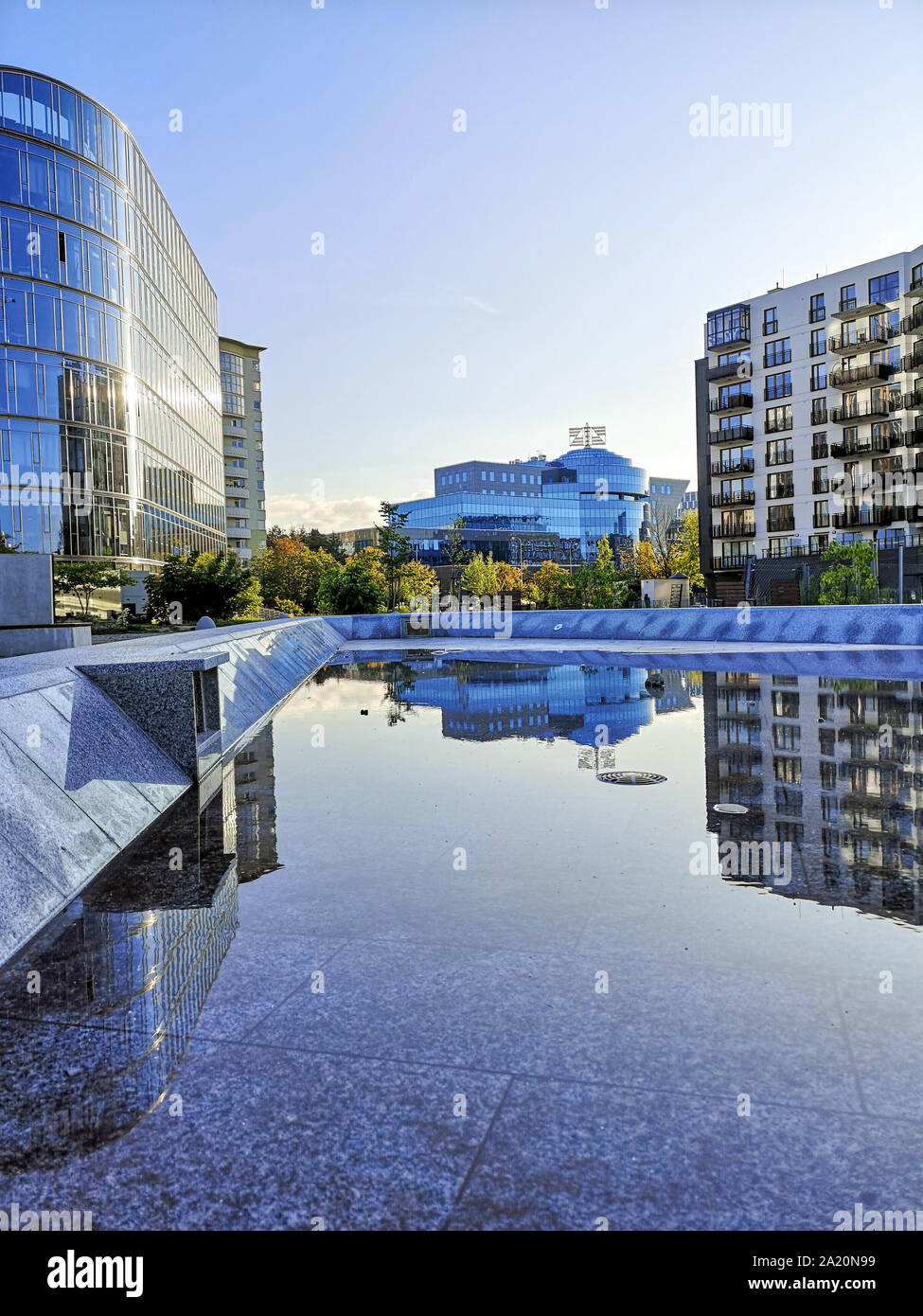 modern office buildings reflecting in the water Stock Photo - Alamy