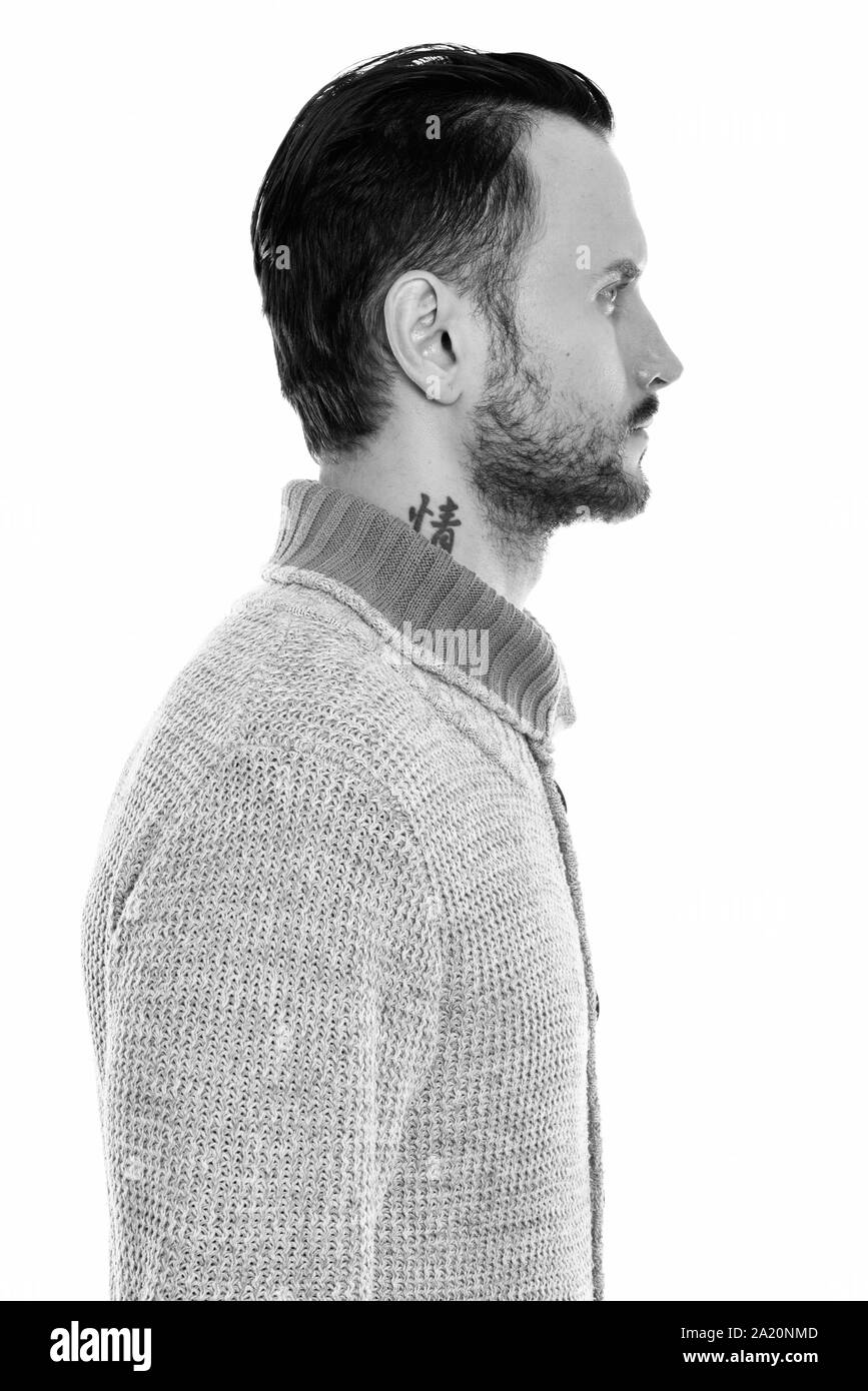 Profile view of young man wearing knitted sweater Stock Photo - Alamy
