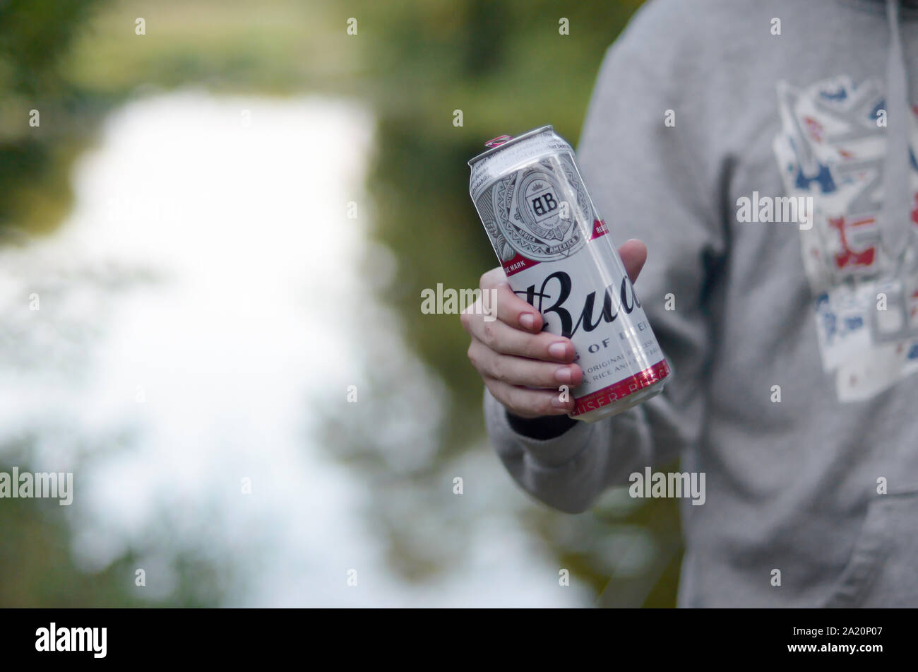 SUMY, UKRAINE - AUGUST 10, 2019: Can of Budweiser Bud beer in male hand ...