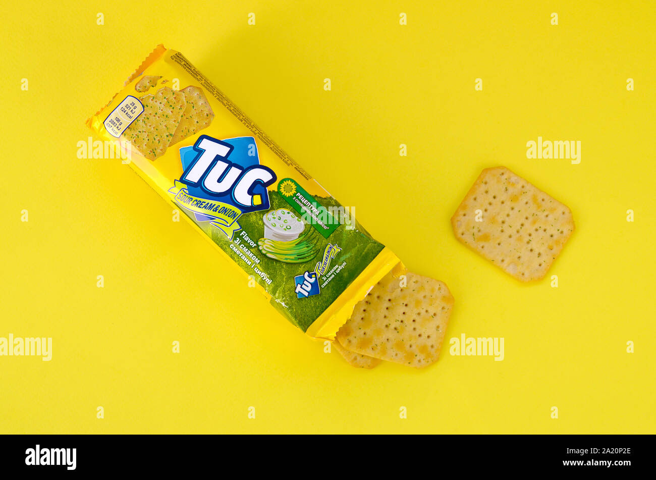 KHARKOV, UKRAINE - SEPTEMBER 23, 2019: Tuc snack pack on bright yellow ...
