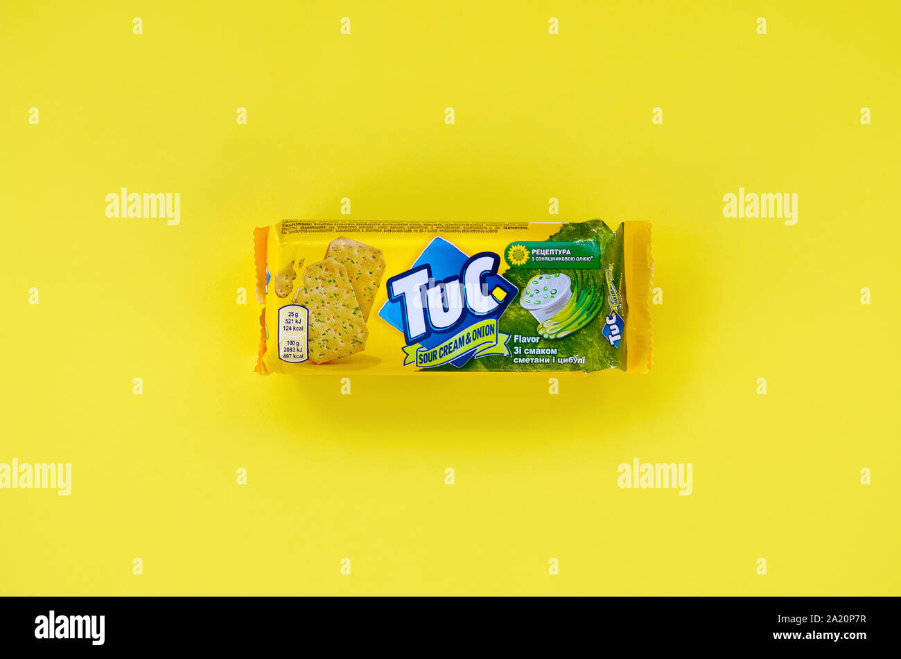 KHARKOV, UKRAINE - SEPTEMBER 23, 2019: Tuc snack pack on bright yellow ...