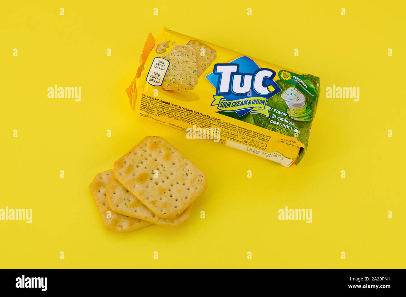 KHARKOV, UKRAINE - SEPTEMBER 23, 2019: Tuc snack pack on bright yellow ...