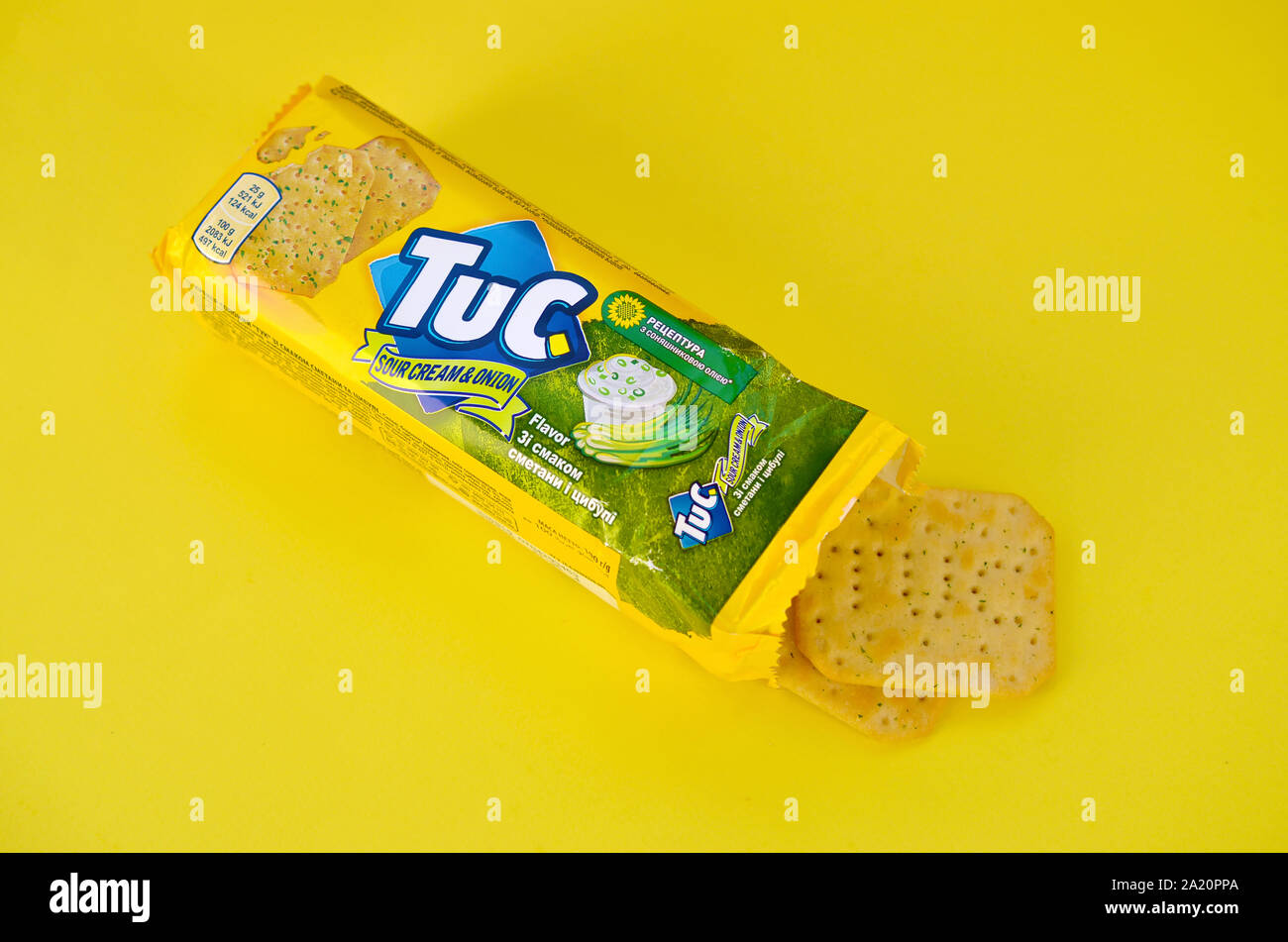 KHARKOV, UKRAINE - SEPTEMBER 23, 2019: Tuc snack pack on bright yellow ...