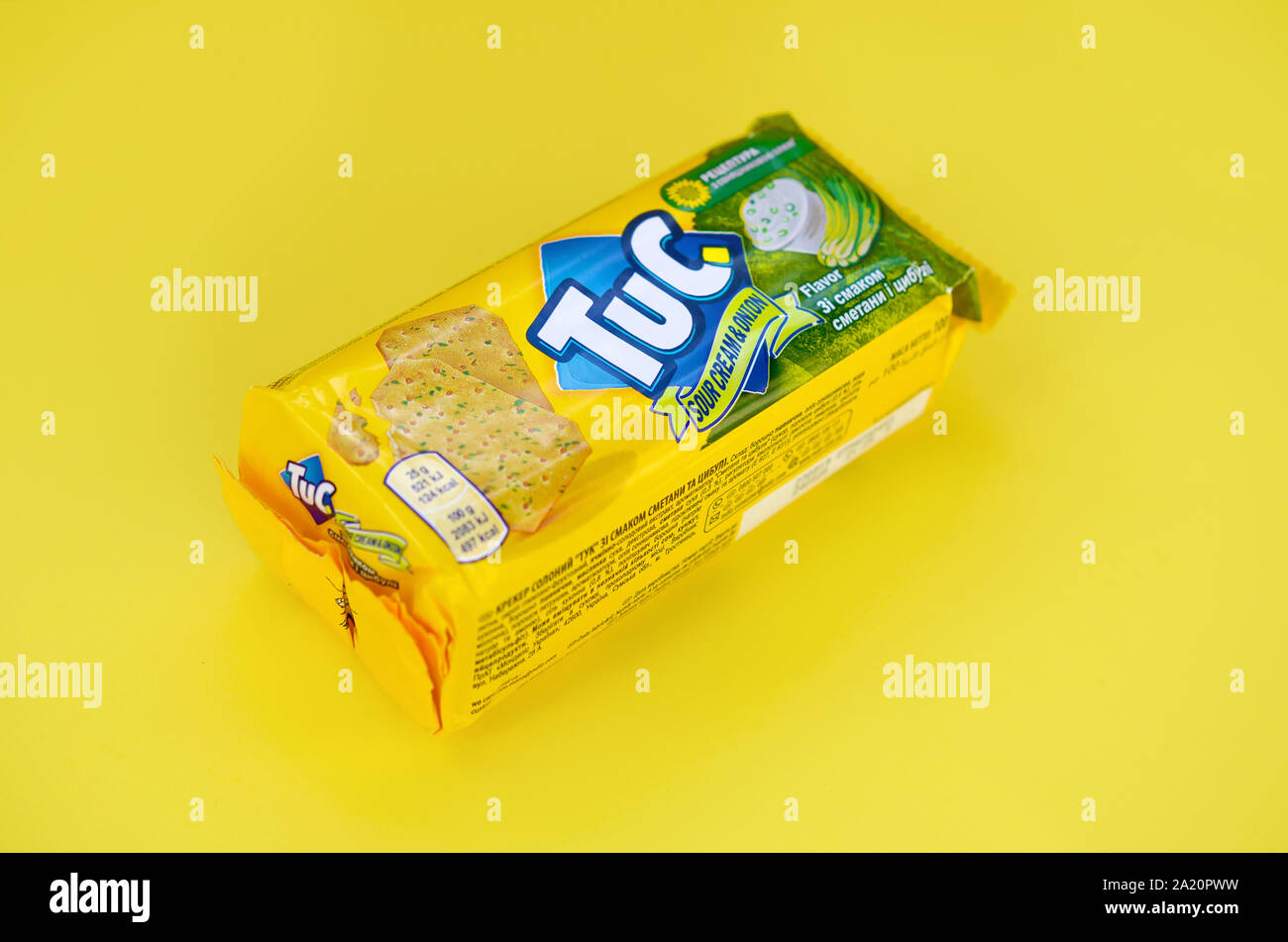 KHARKOV, UKRAINE - SEPTEMBER 23, 2019: Tuc snack pack on bright yellow ...