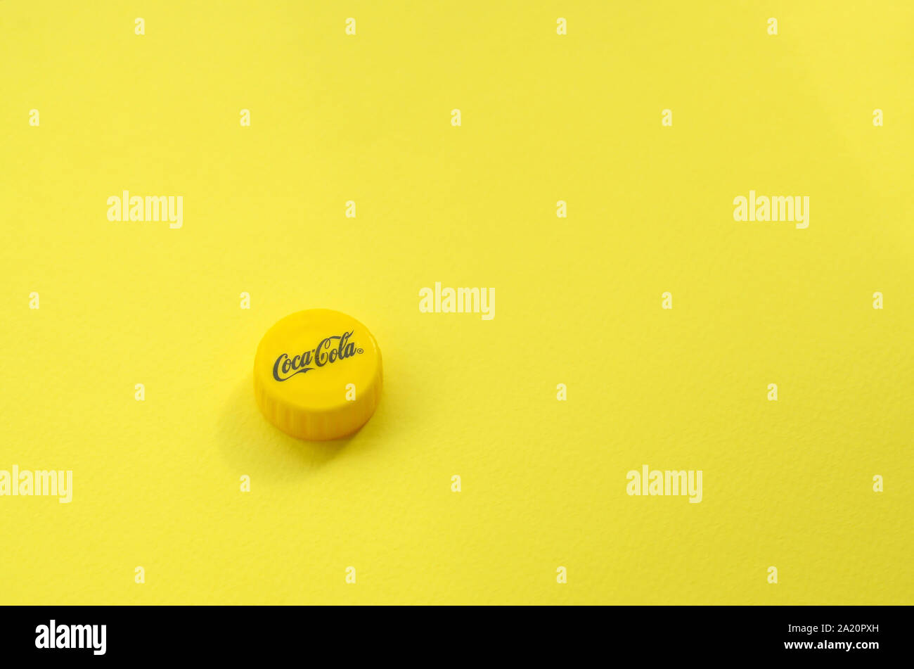 KHARKOV, UKRAINE - SEPTEMBER 8, 2019: Single yellow bottle lid with ...