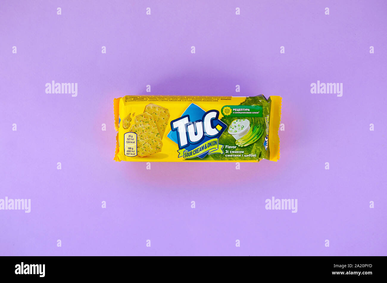 KHARKOV, UKRAINE - SEPTEMBER 23, 2019: Tuc snack pack on bright violet ...