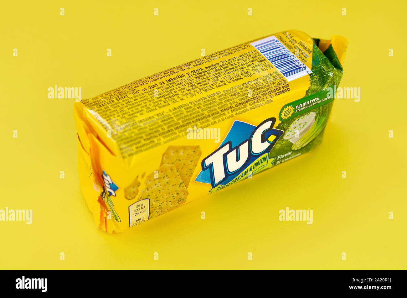 KHARKOV, UKRAINE - SEPTEMBER 23, 2019: Tuc snack pack on bright yellow ...