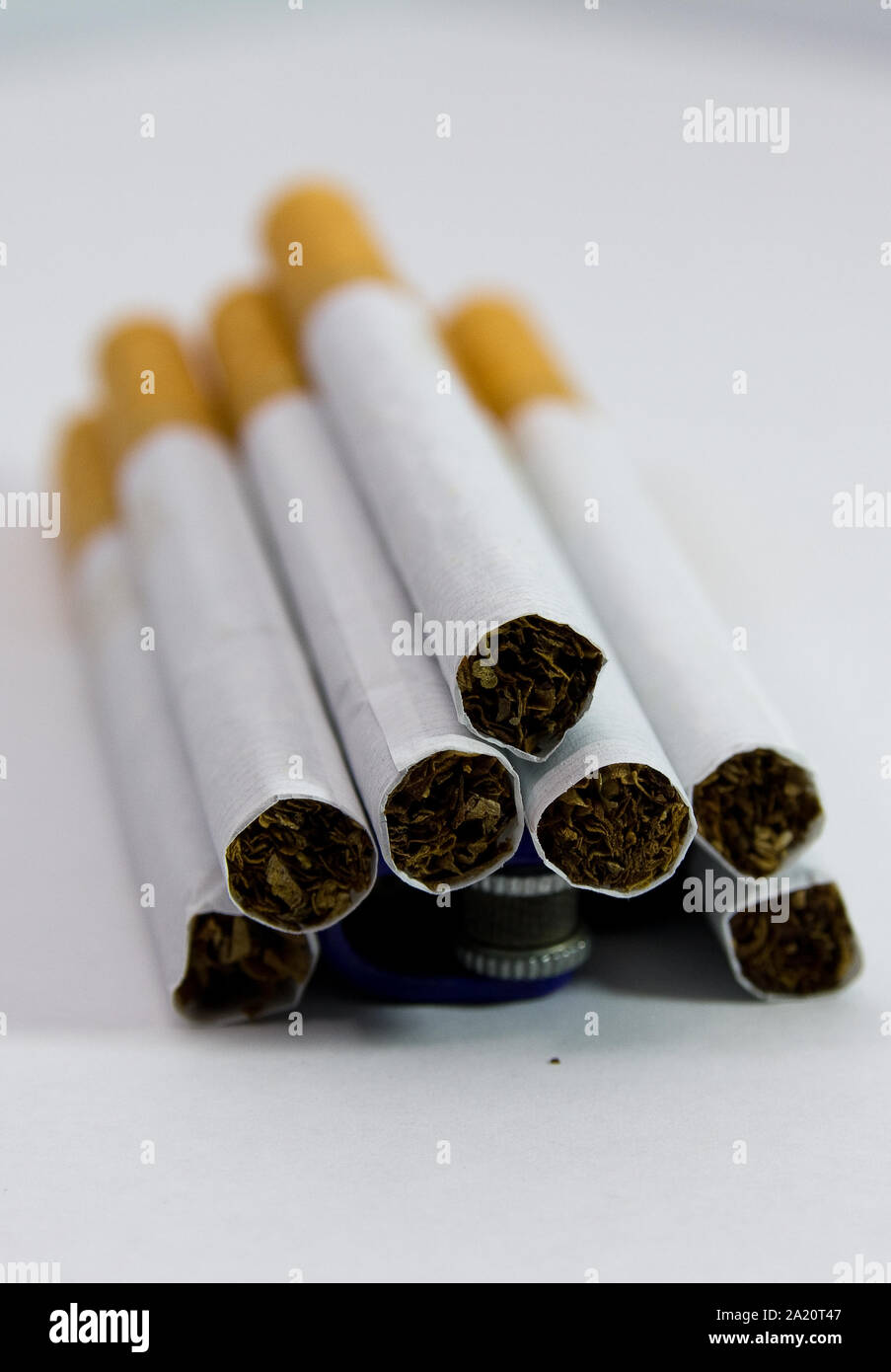 opened-pack cigarettes and lighter close up Stock Photo - Alamy