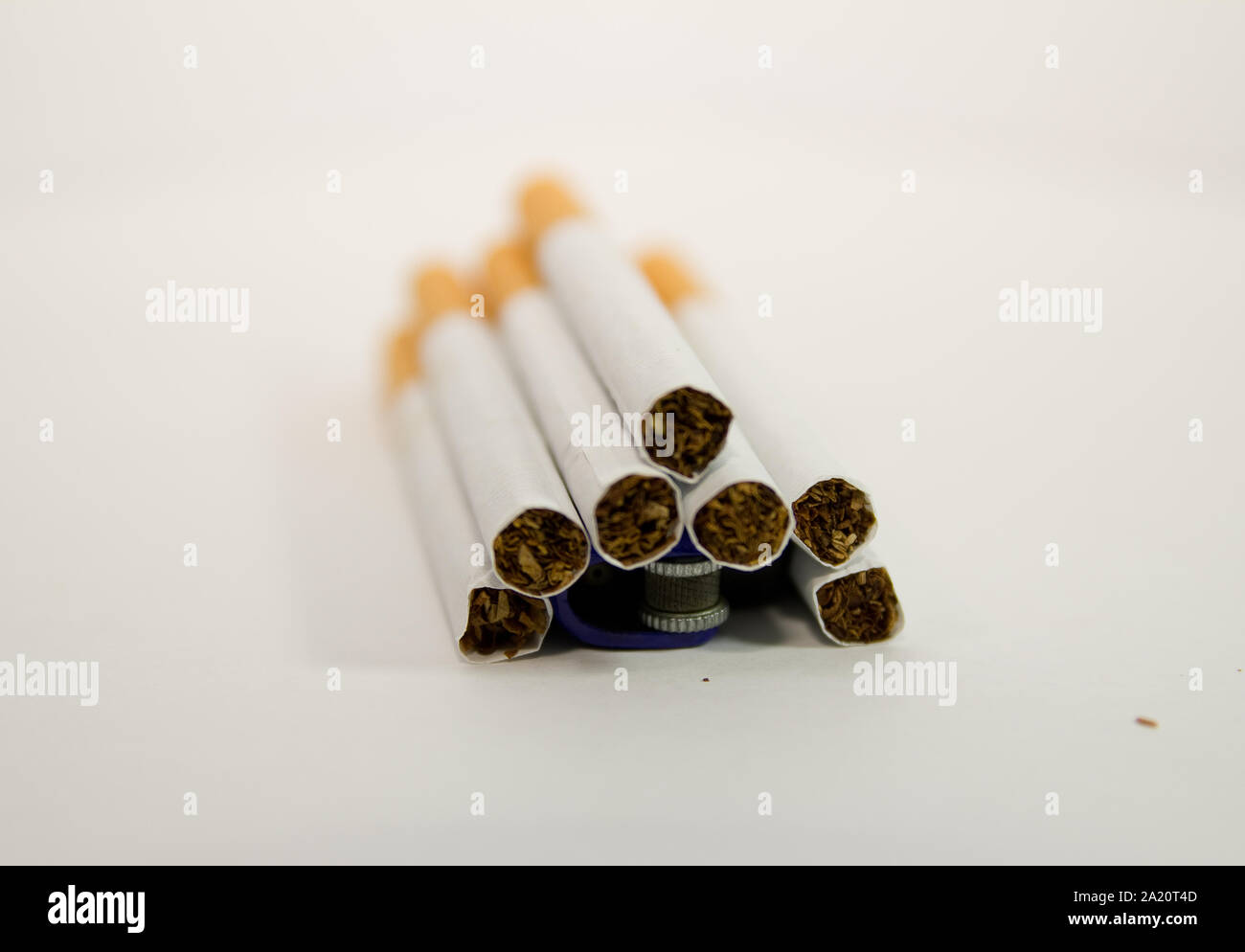 opened-pack cigarettes and lighter close up Stock Photo - Alamy