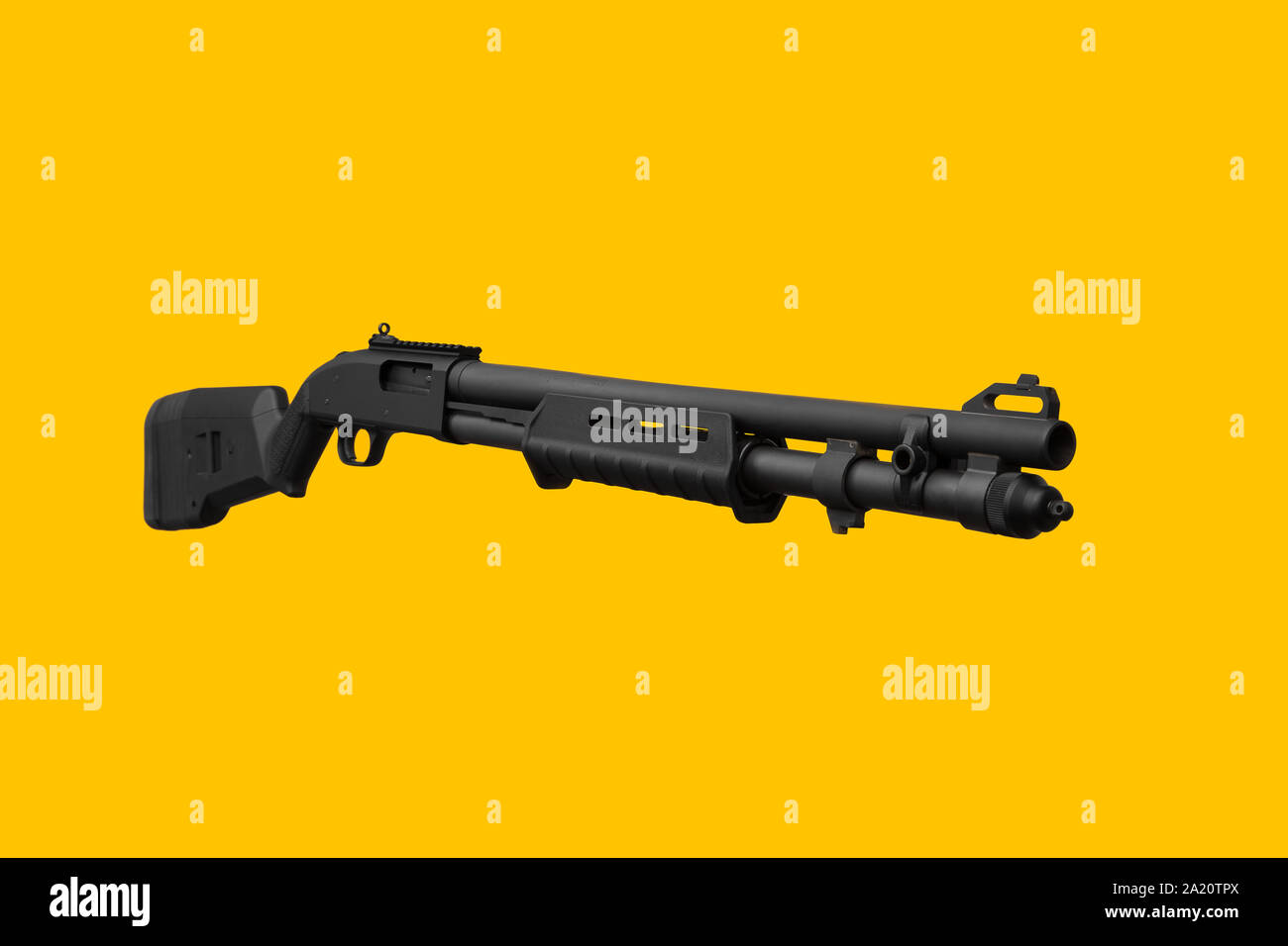 Modern black shotgun on a yellow background. Weapons for the police ...