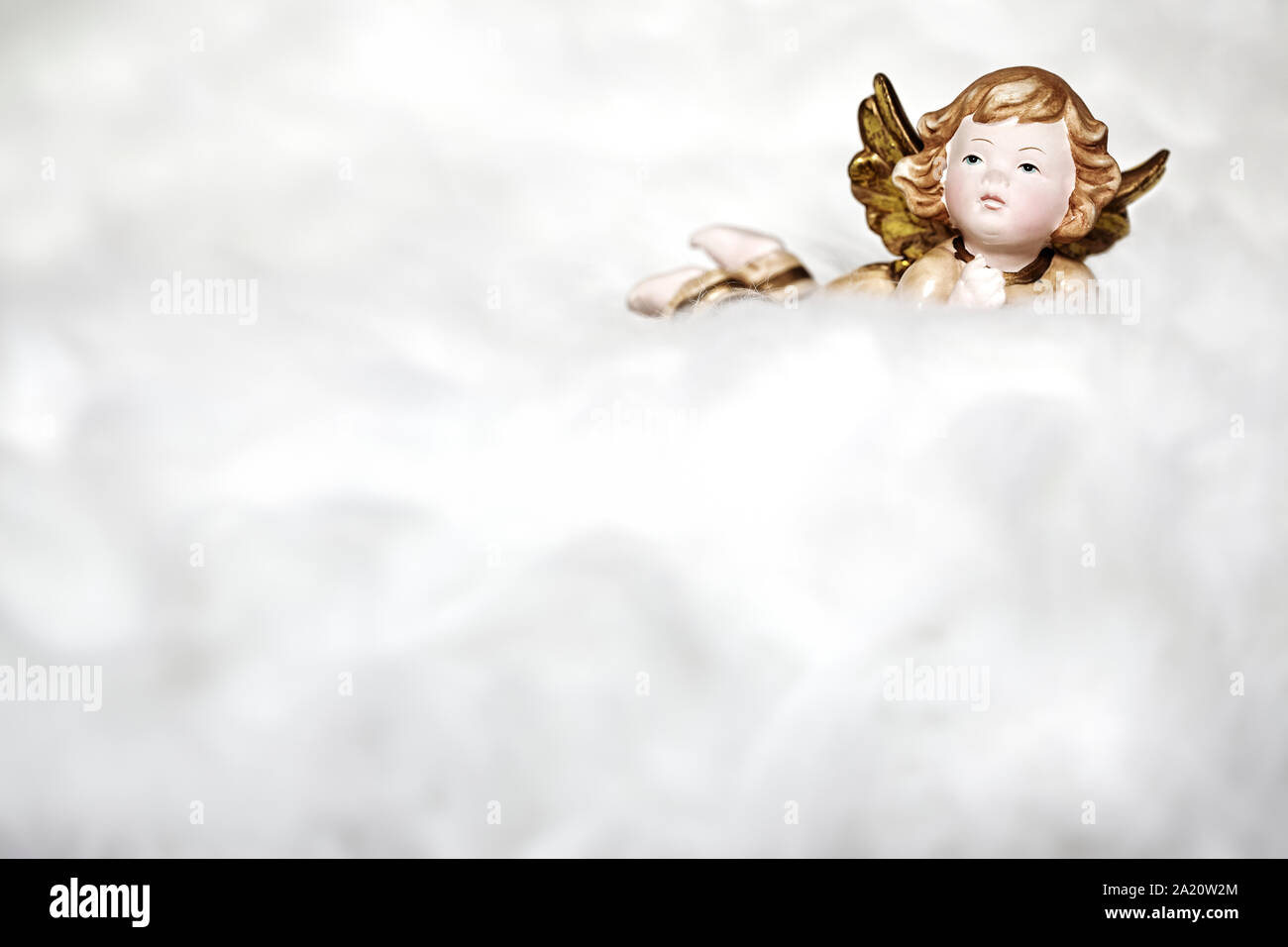 Sweet angel lying on cloud Stock Photo - Alamy