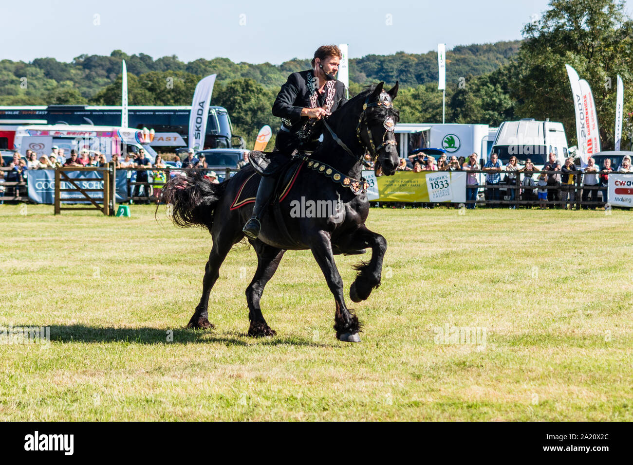 Entertainer and display artist Jonathan Marshall rides his black ...