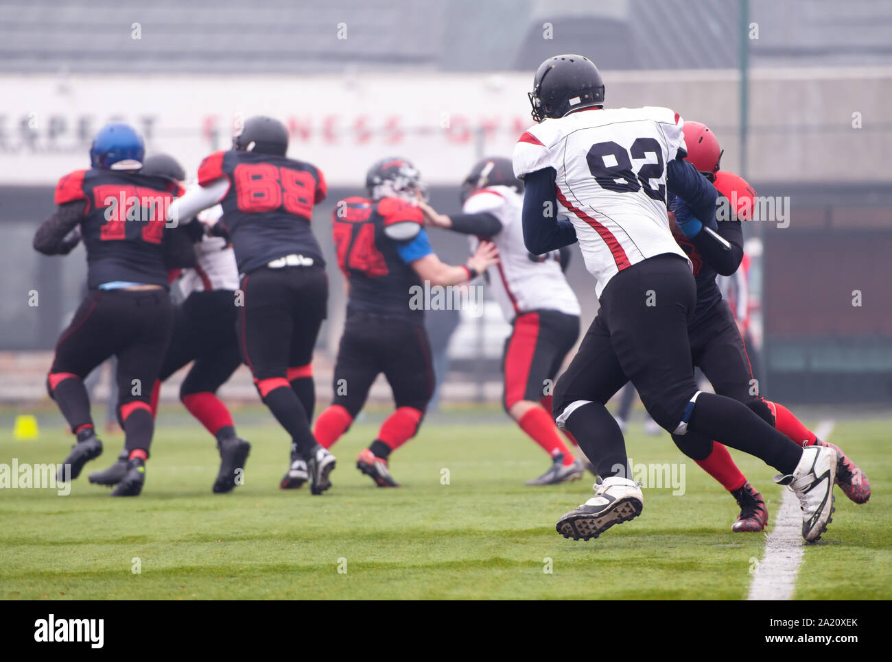 group of young professional american football players in action during ...
