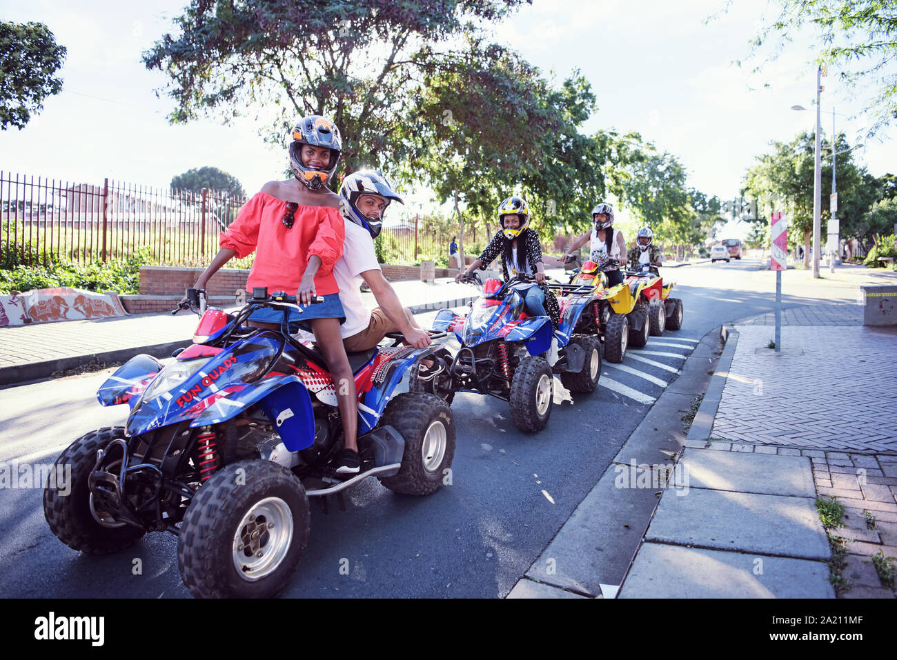 People riding quad bikes in Soweto Stock Photo - Alamy