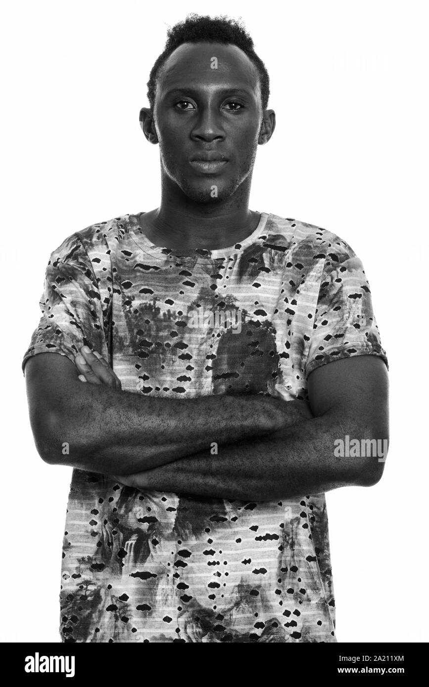 Young black African man with arms crossed Stock Photo - Alamy
