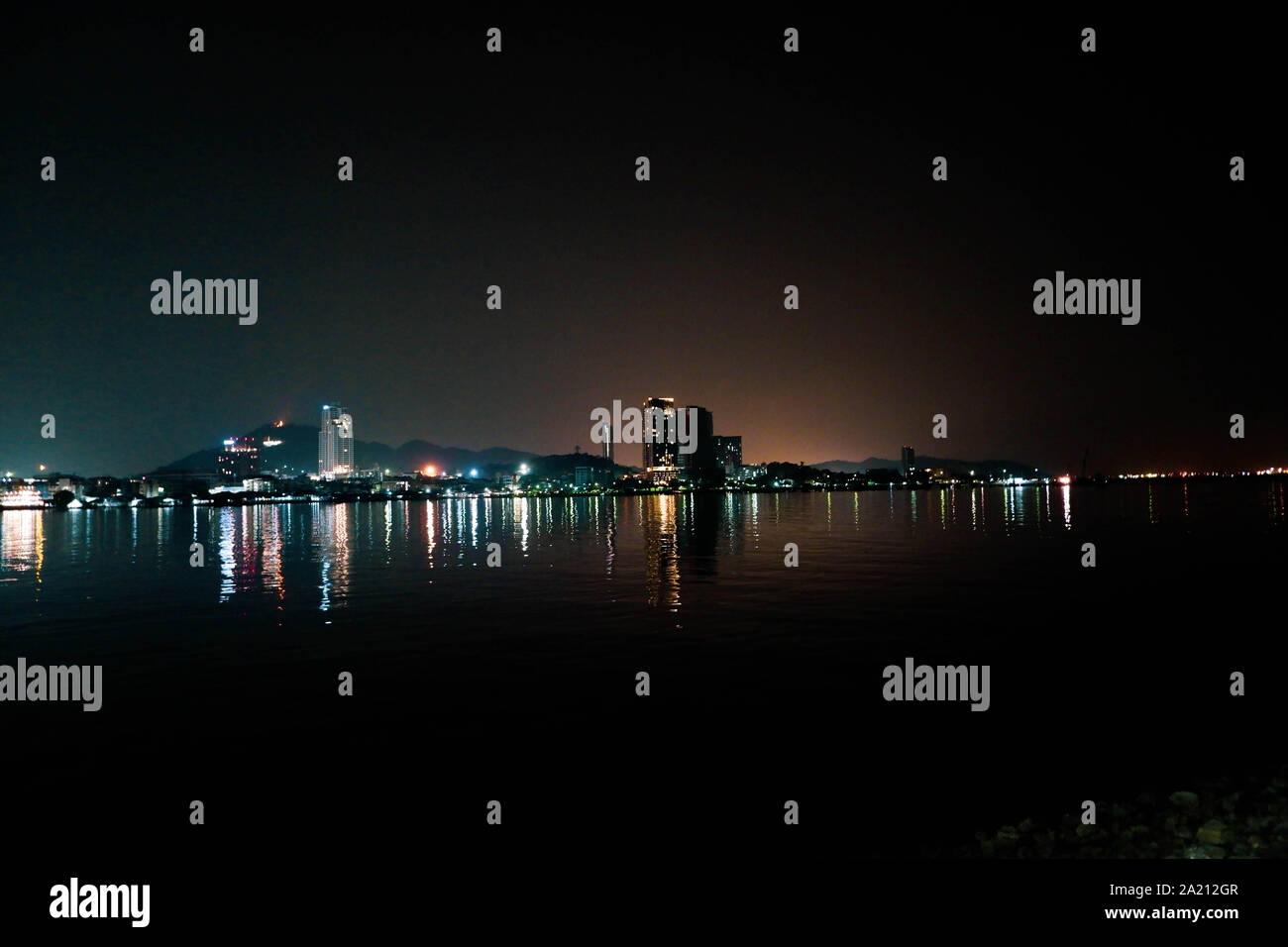 The city by the sea at night Stock Photo - Alamy