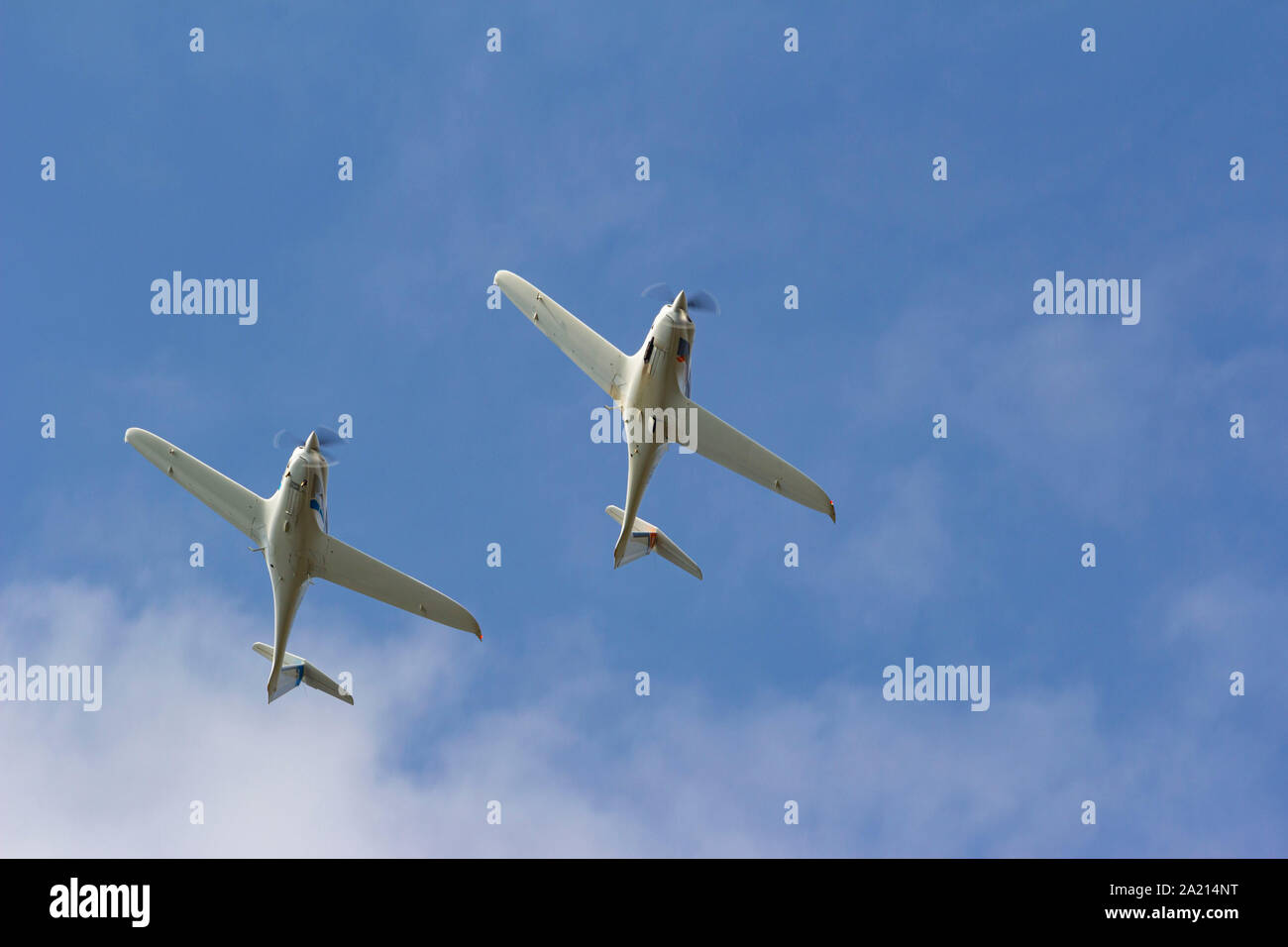Two aeroplanes making a loop Stock Photo - Alamy