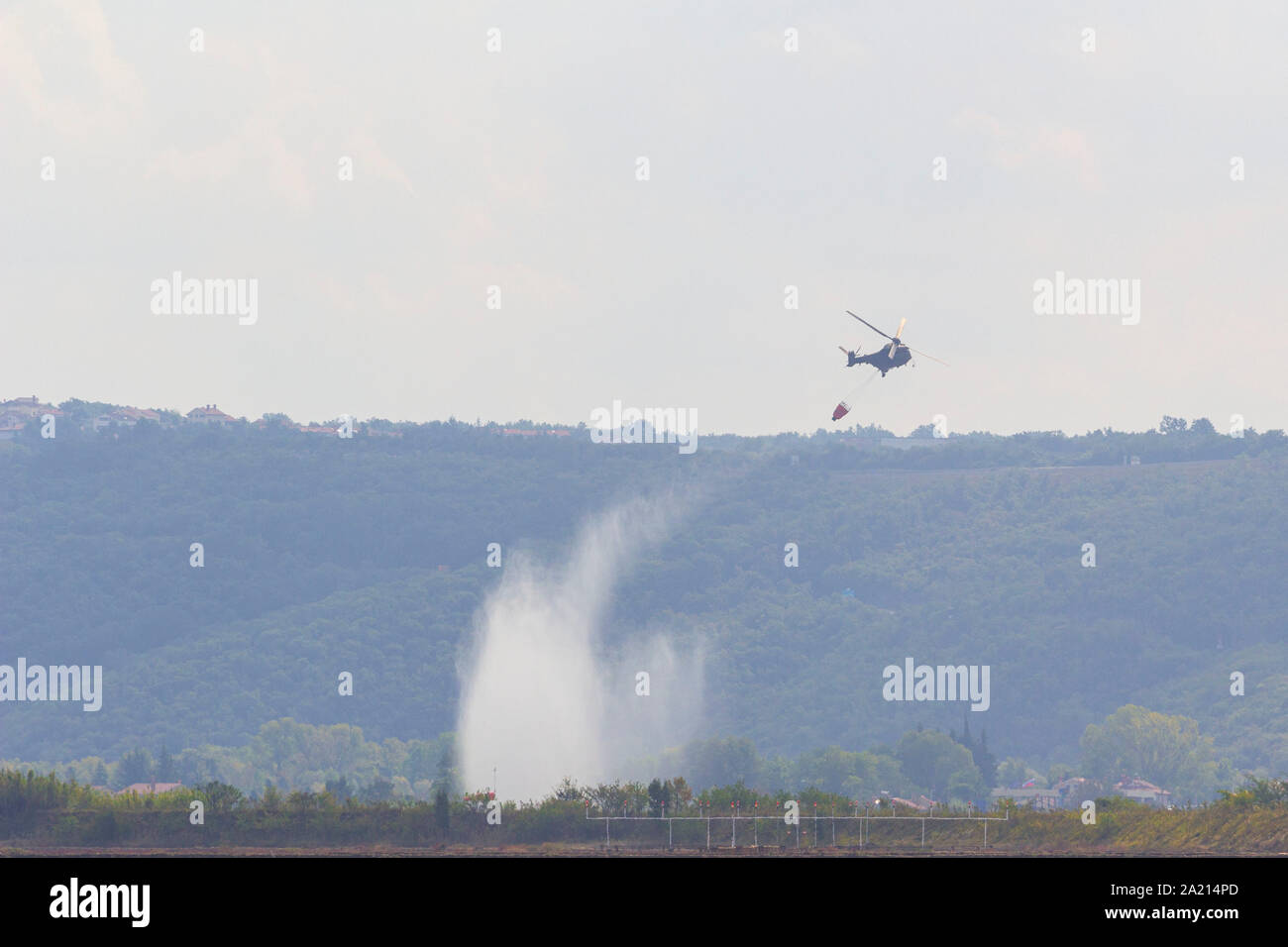 Helicopter putting out fire Stock Photo - Alamy