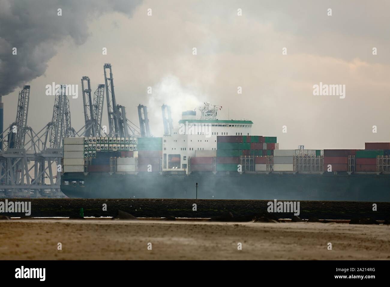 Cargo ship exhaust smoke Stock Photo - Alamy