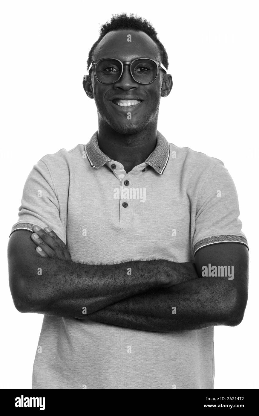 Young happy black African man smiling with arms crossed Stock Photo - Alamy