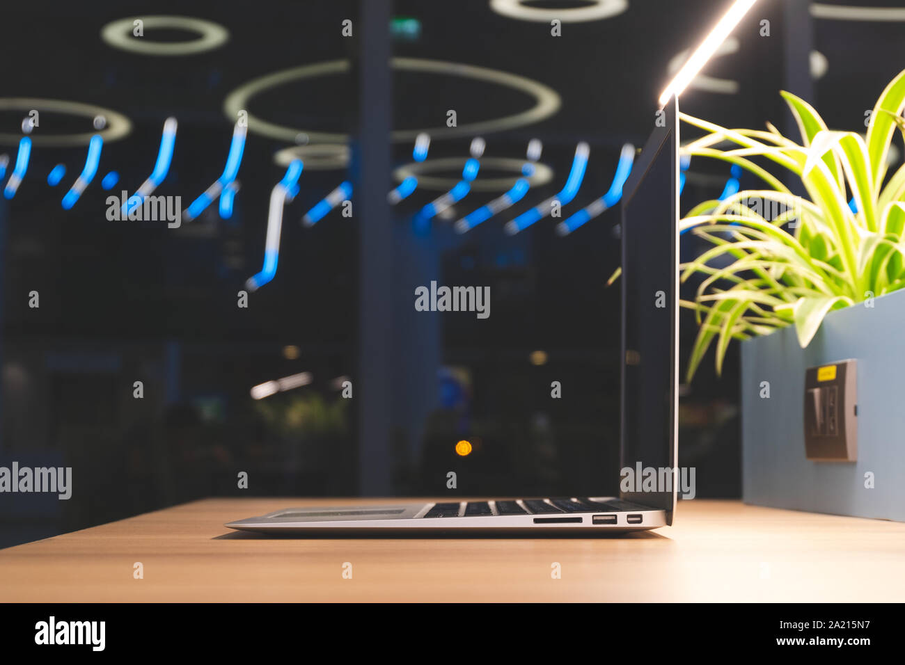 Close up Laptop on desk with big window in modern office Stock Photo ...