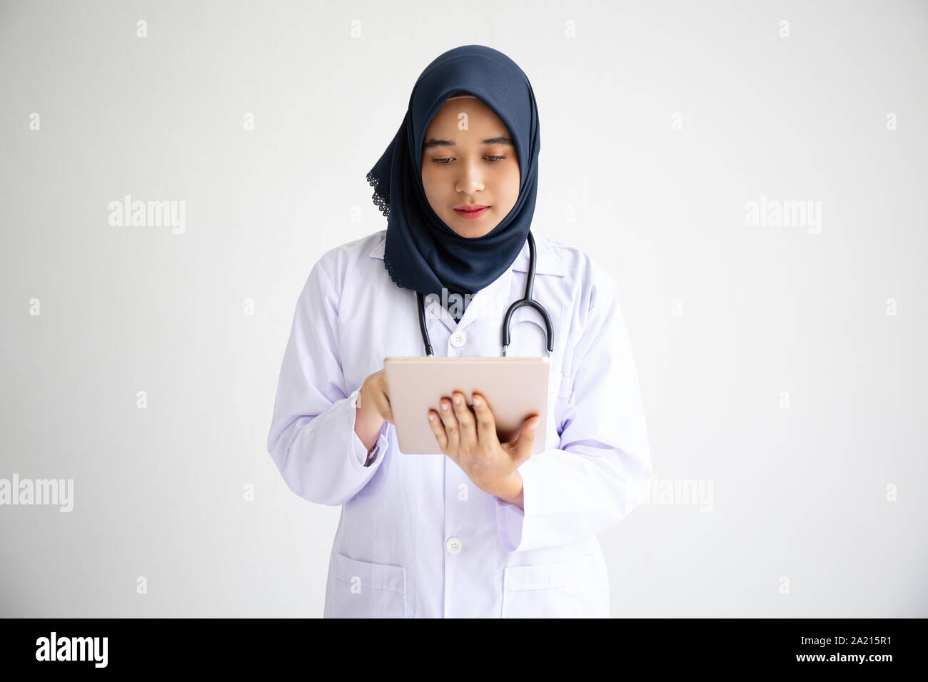 Young Arab Muslim intern doctor women smile on isolate white background ...