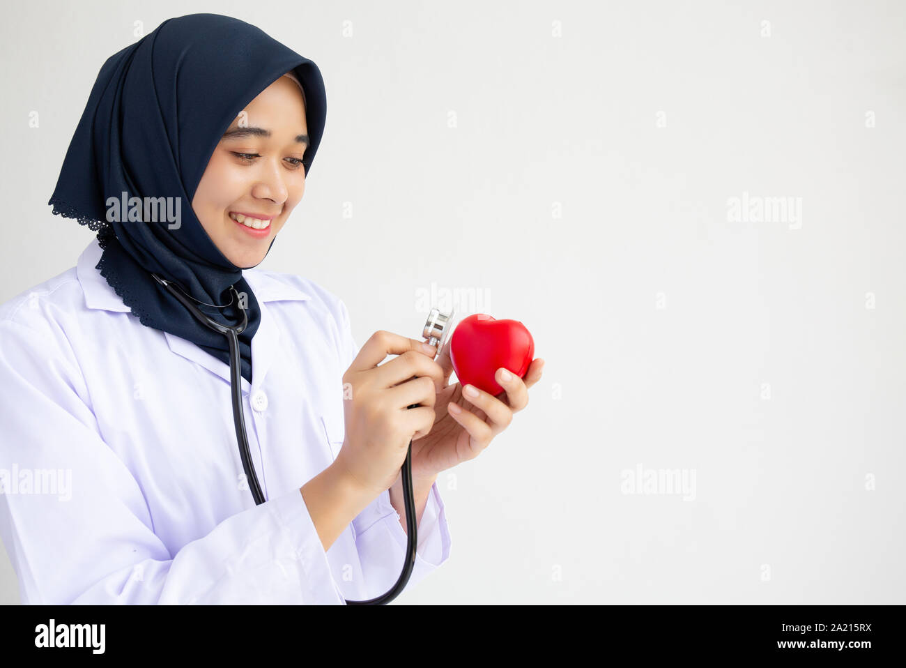 Young Arab Muslim intern doctor women smile on isolate white background ...
