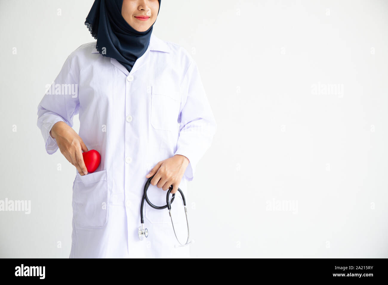 Young Arab Muslim intern doctor women smile on isolate white background ...