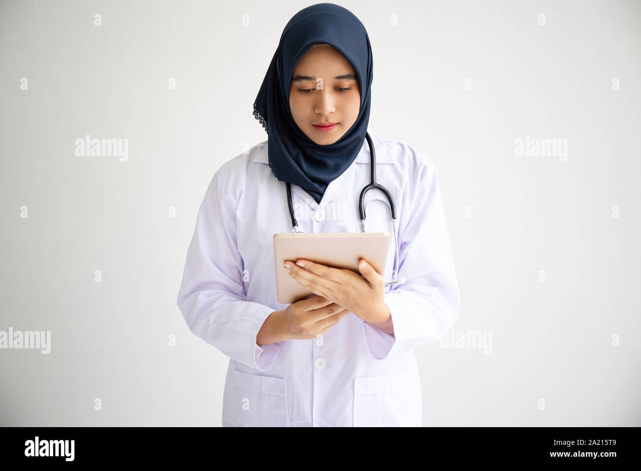 Young Arab Muslim intern doctor women smile on isolate white background ...