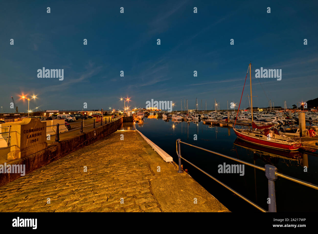 Night scene in St Peter Port harbour on the island of Guernsey; UK ...