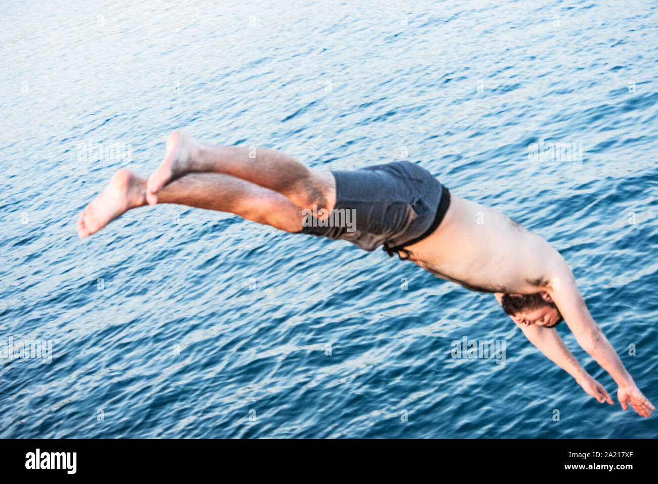 Young man dives hi-res stock photography and images - Alamy