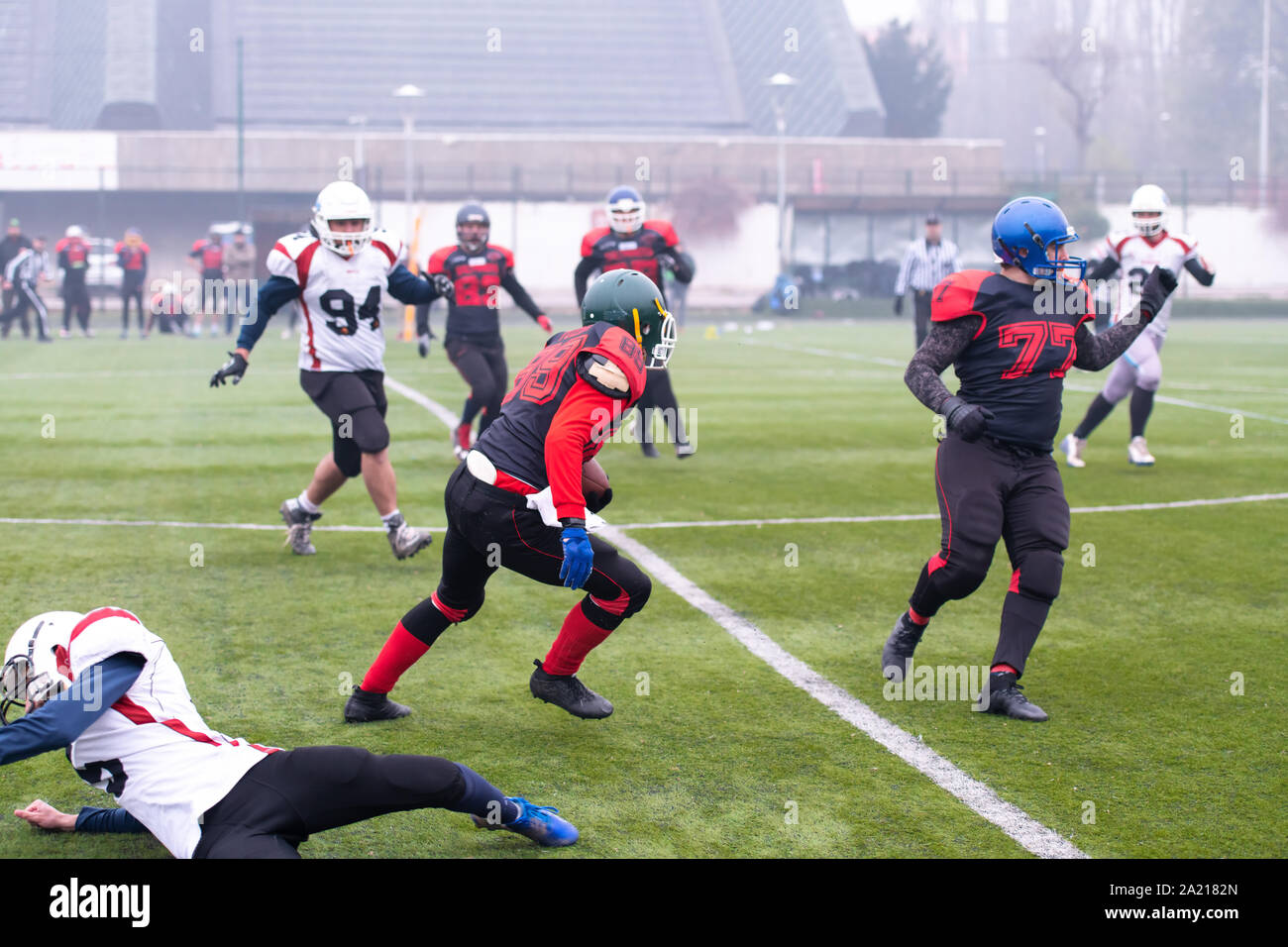 group of young professional american football players in action during ...