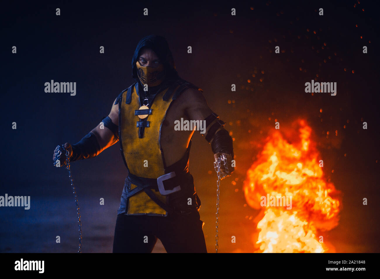 Man portraying warrior Scorpion with chains in his hands poses at the ...