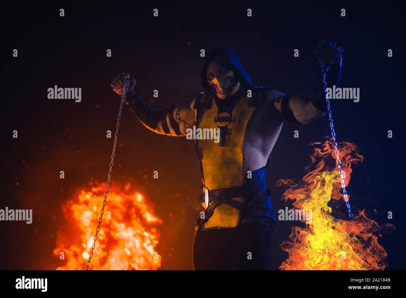 Man portraying warrior Scorpion with chains in his hands poses at the ...