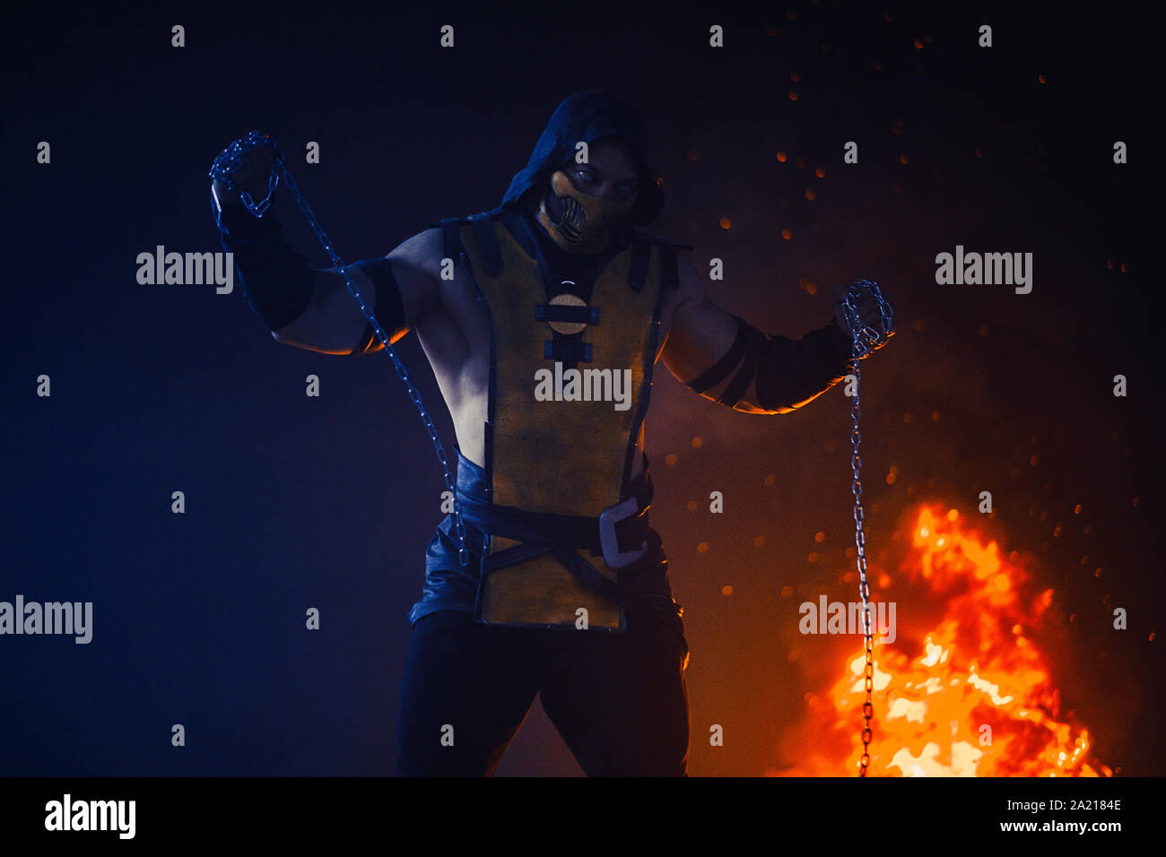 Man portraying warrior Scorpion with chains in his hands poses at the ...