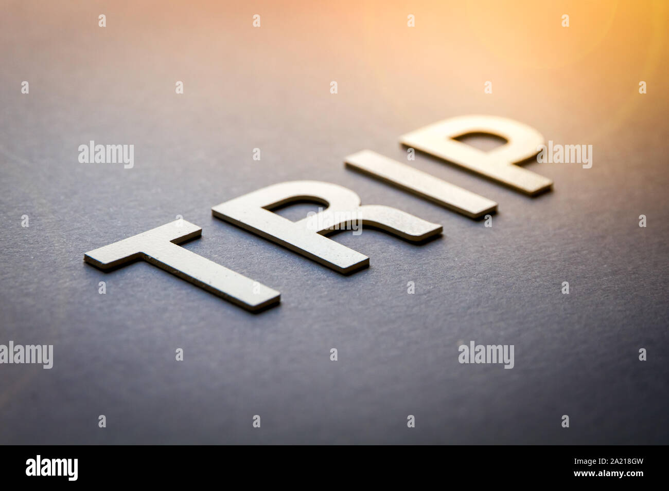 Word trip written with white solid letters on a board Stock Photo - Alamy