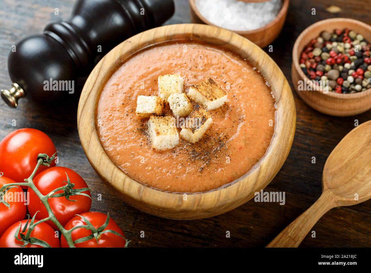 vegetable cream soup puree in a plate on a brown wooden background ...