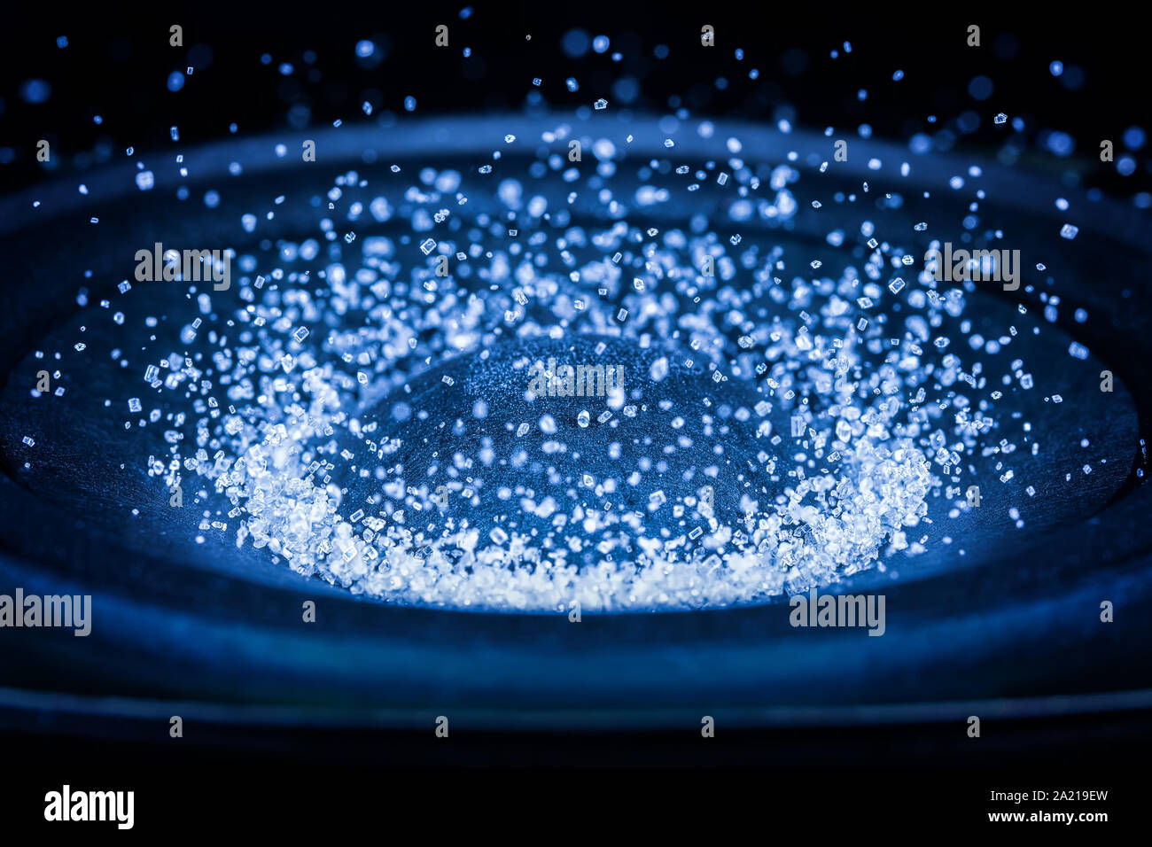 Salt crystals bouncing from vibration on a loudspeaker Stock Photo - Alamy