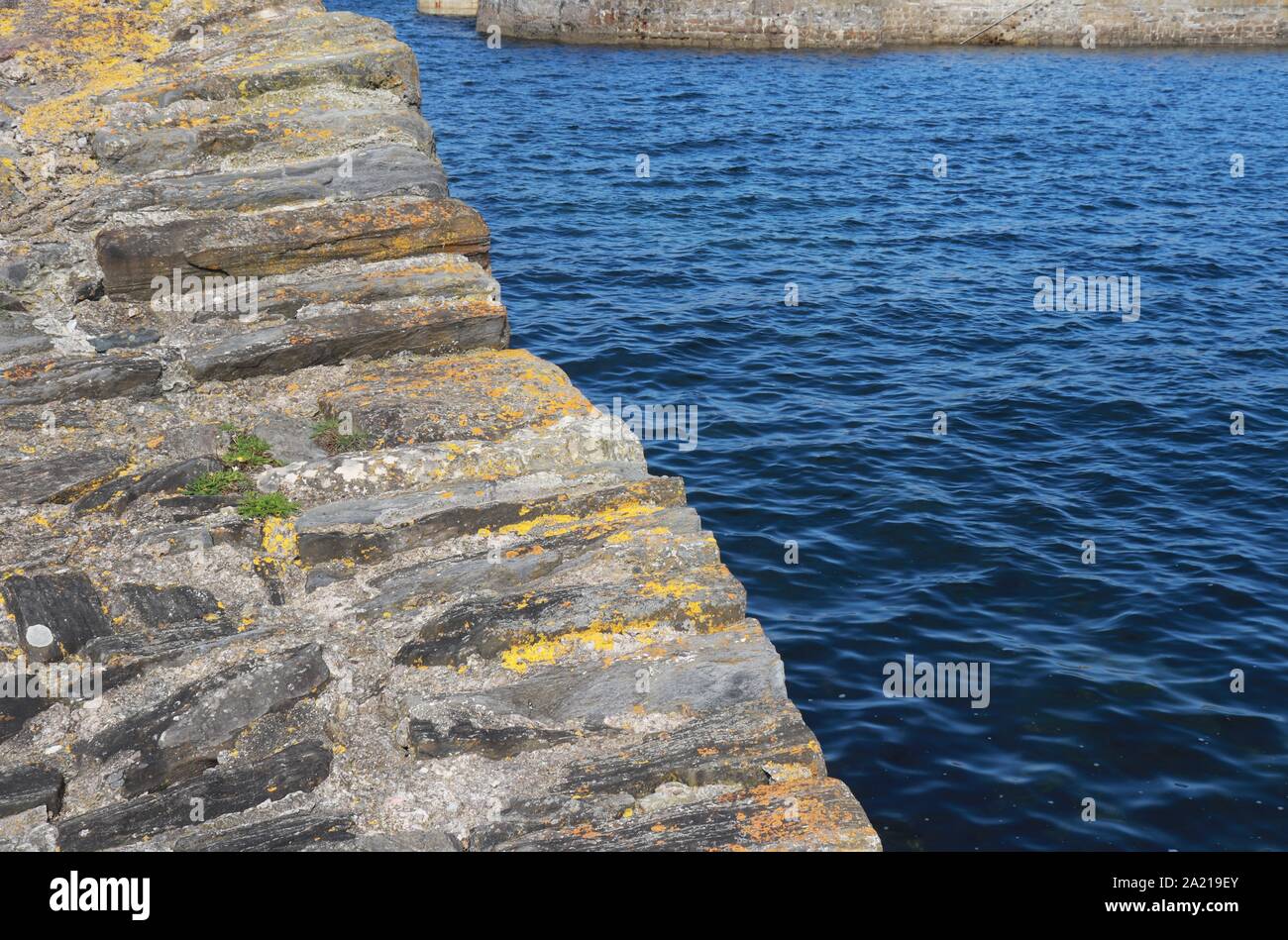 Harbour wall and sea Stock Photo - Alamy