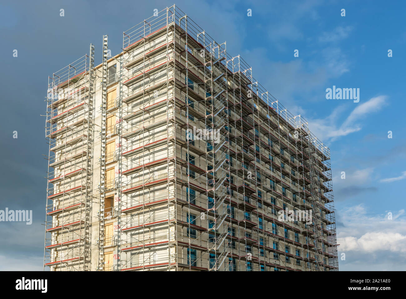 Construction of a skyscraper with scaffolding on the facade Stock Photo ...