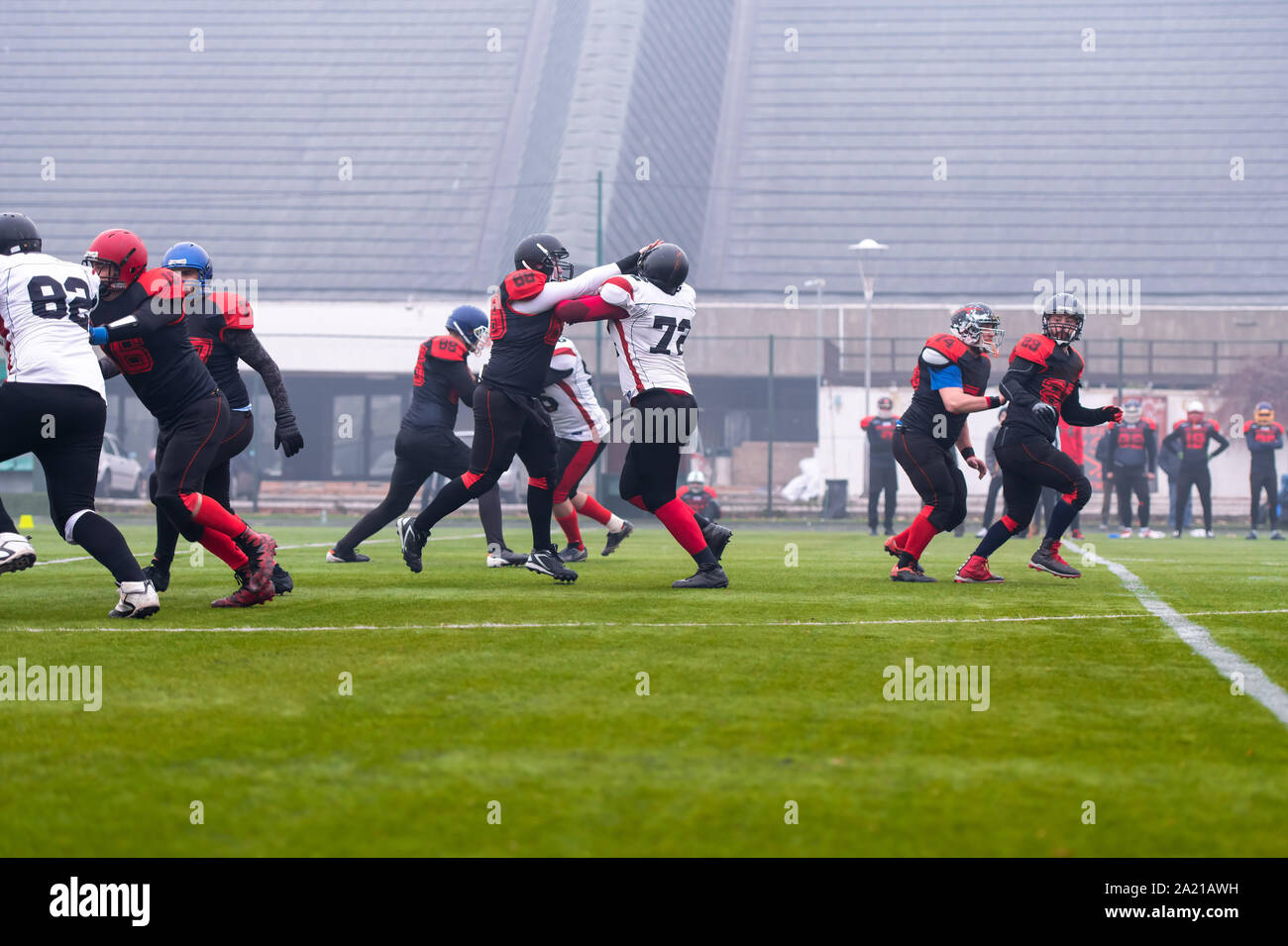group of young professional american football players in action during ...