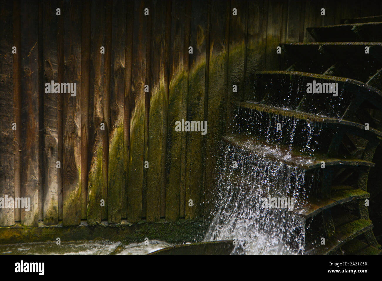 Working watermill wheel with falling water in the village Stock Photo ...