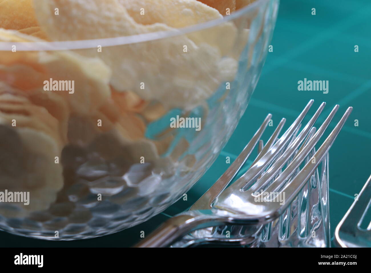 Crisps in transparent bowl Stock Photo - Alamy