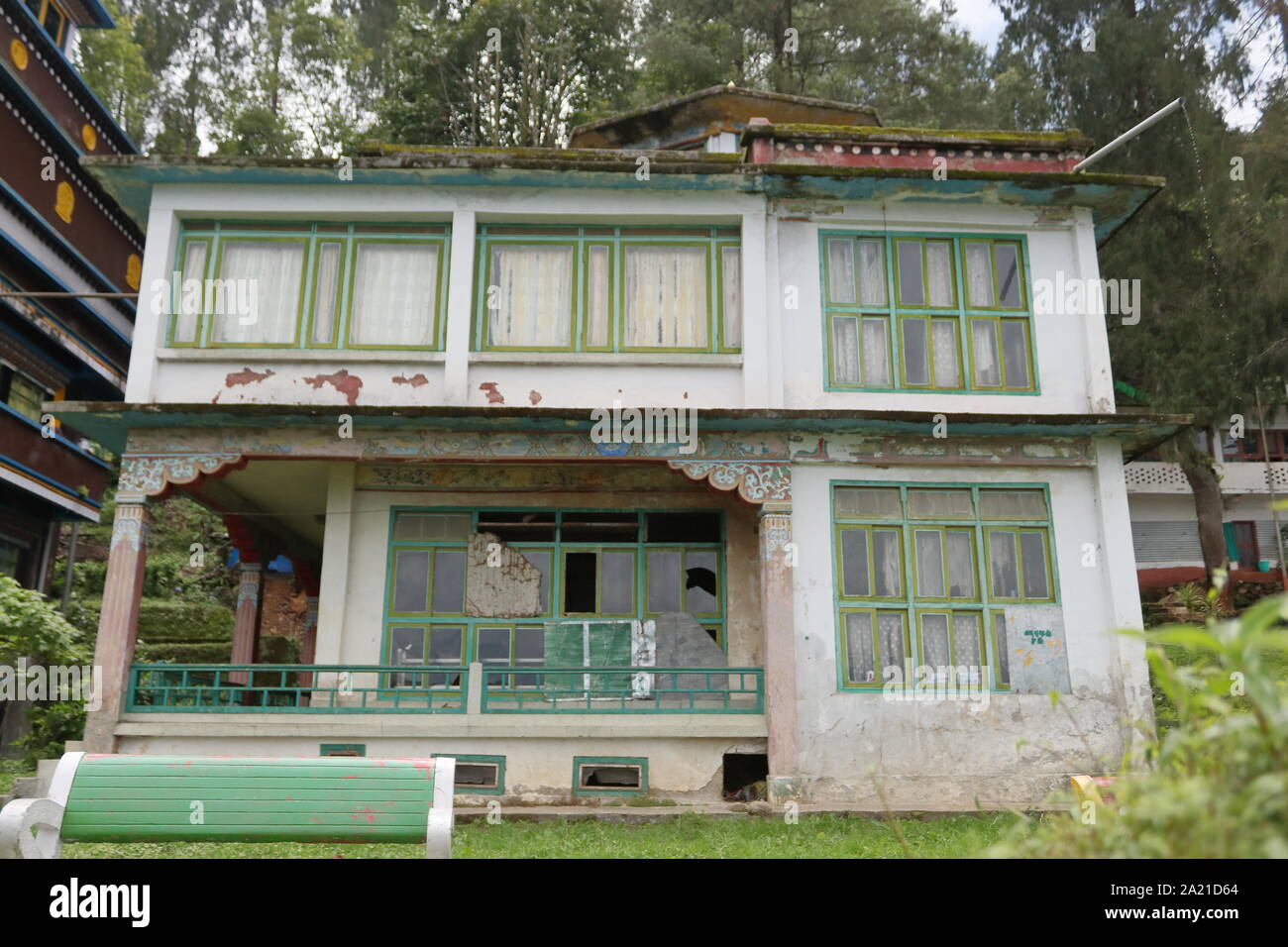 Small old abandoned cottage house with broken window glasses discolored ...