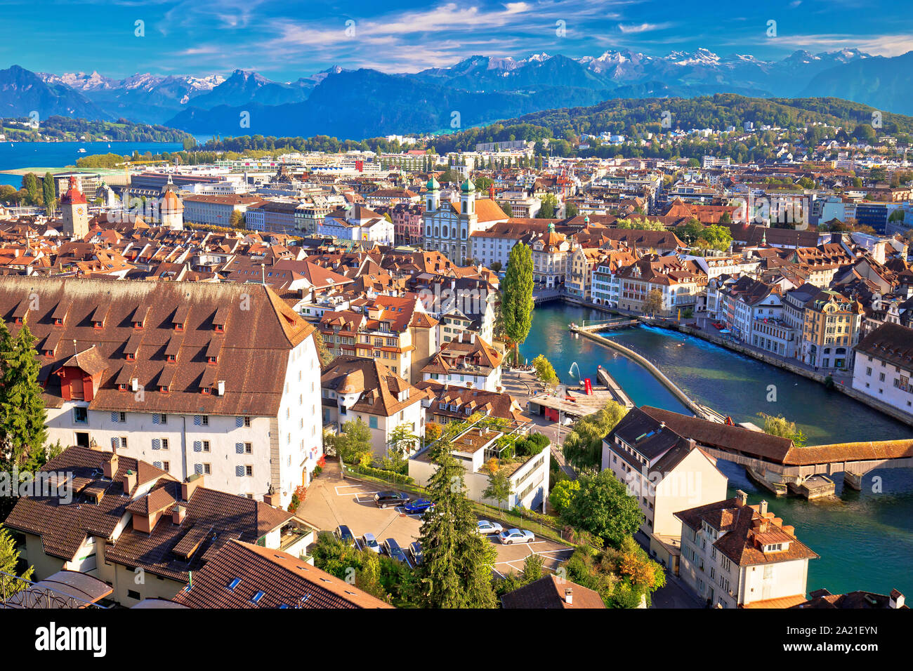 City of Luzern riverfront and rooftops aerial view, Alps landscape of ...
