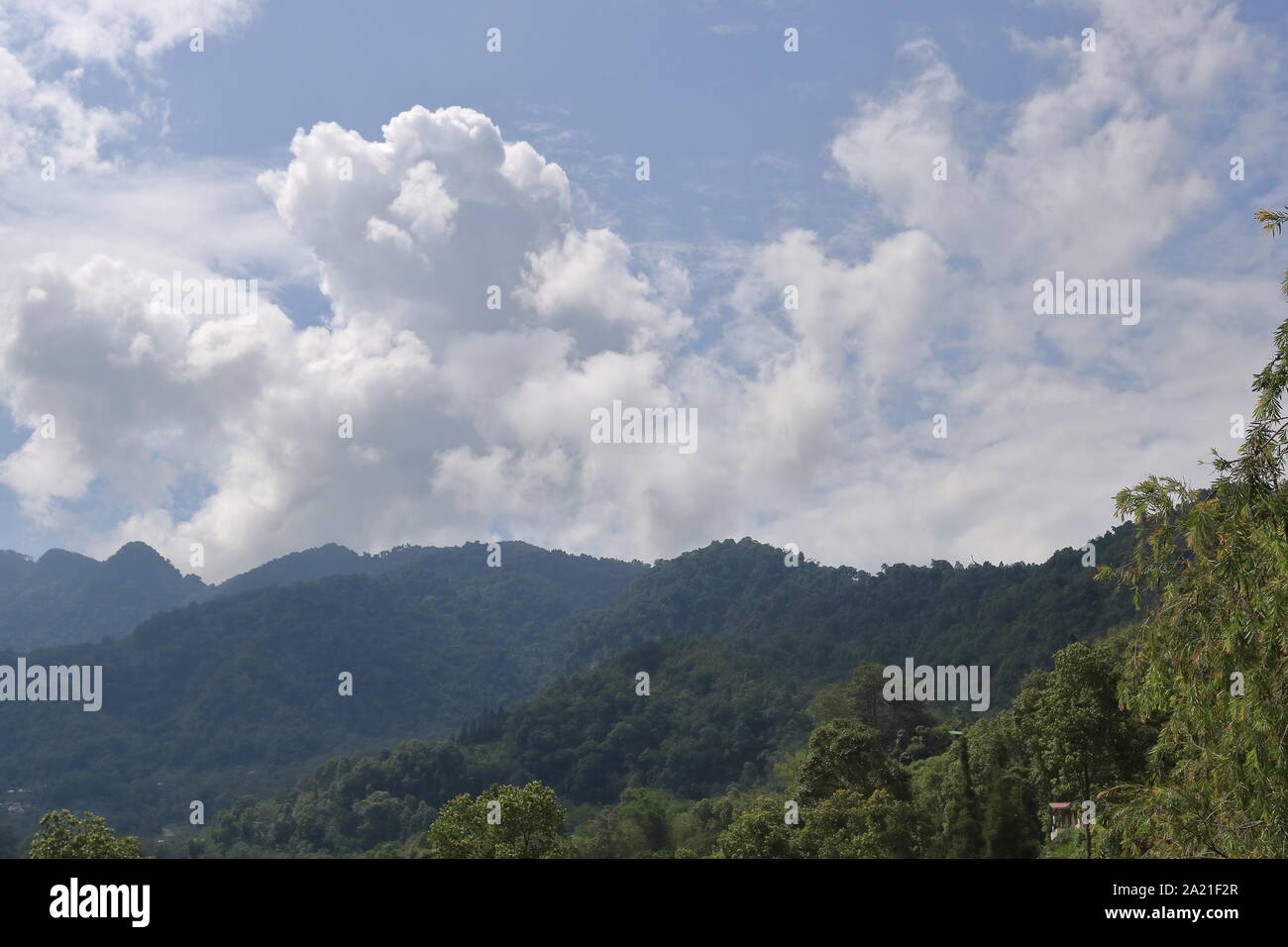 On a very cloudy day Mountains covered with clouds in Sikkim, India ...