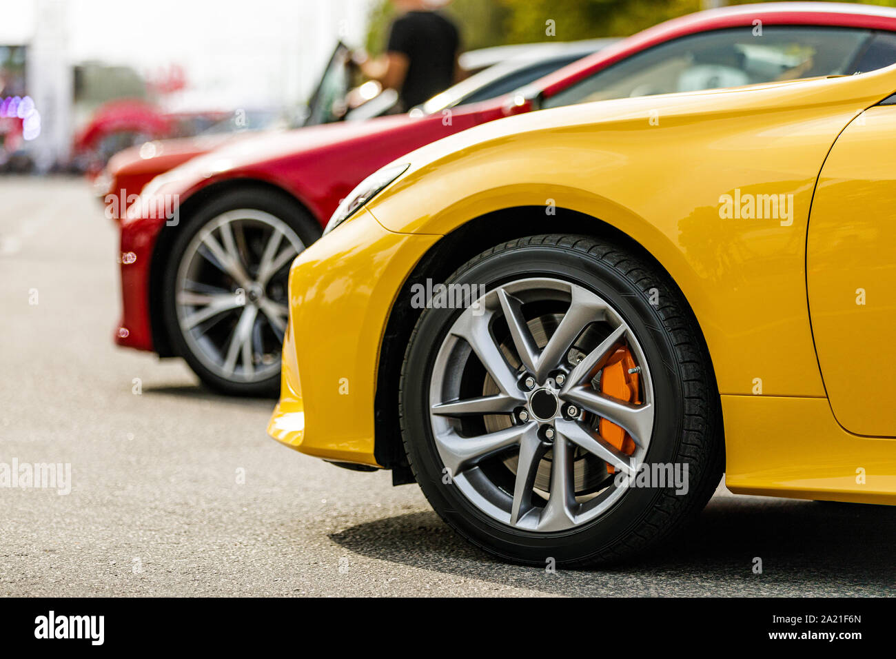 luxury cars in a row. Cars parked on the street Stock Photo - Alamy